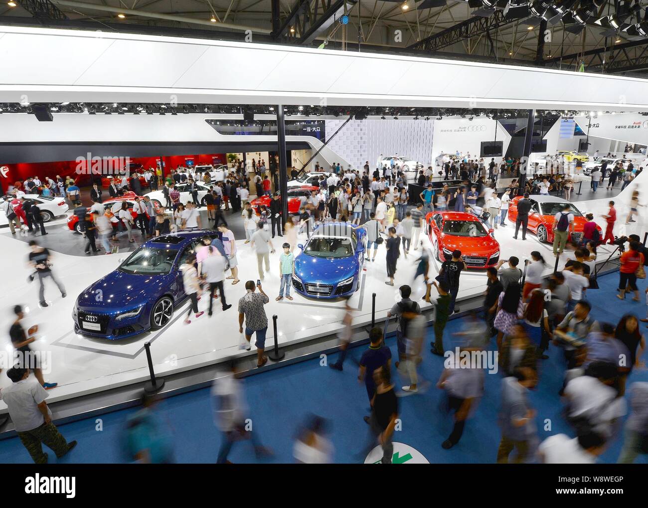 --FILE--Visitors view Audi cars on display at an auto show in Chengdu ...