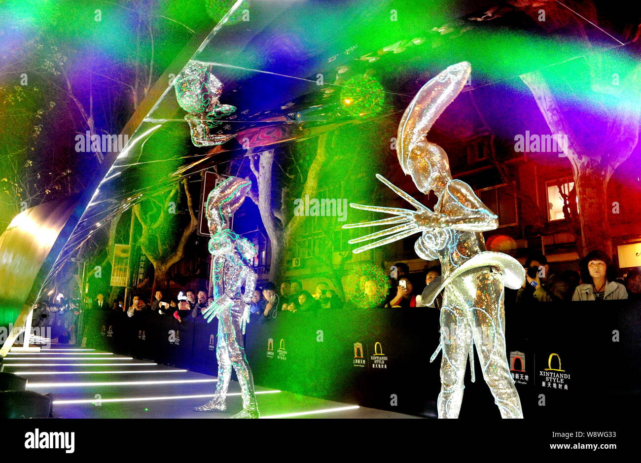 Entertainers dressed in alien-style costumes perform during the Design ...