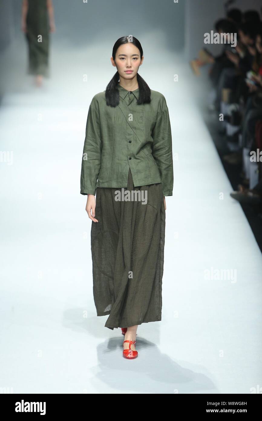 A model displays a new creation by designer Chen Yuan at the Moho Chen ...