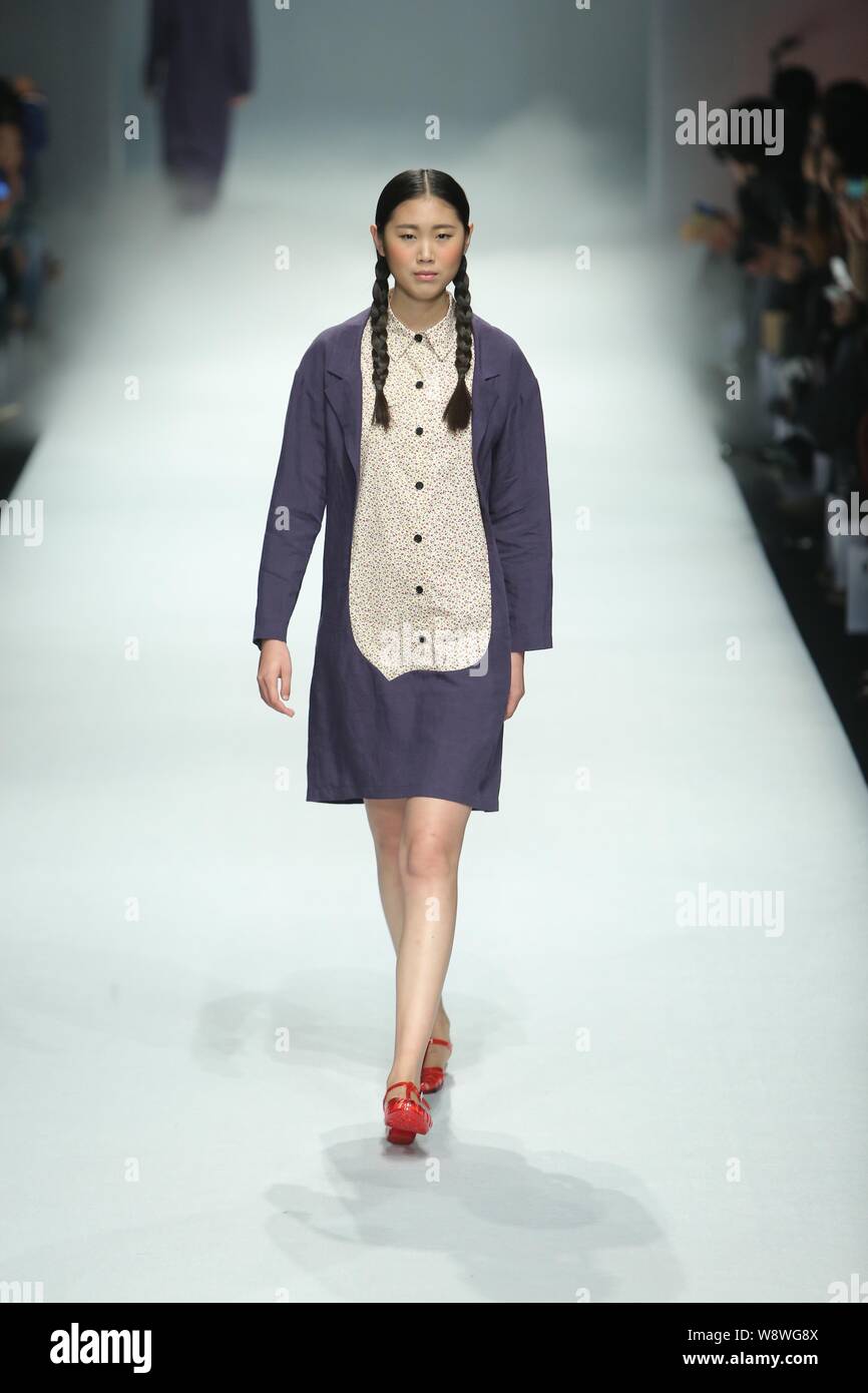 A model displays a new creation by designer Chen Yuan at the Moho Chen ...