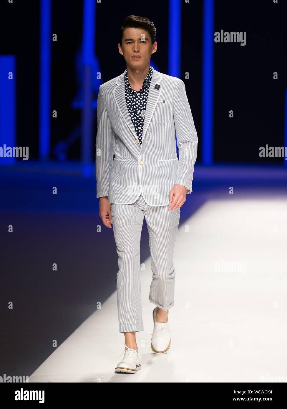 A model displays a new creation by designer Yuan Bing at the VISCAP ...