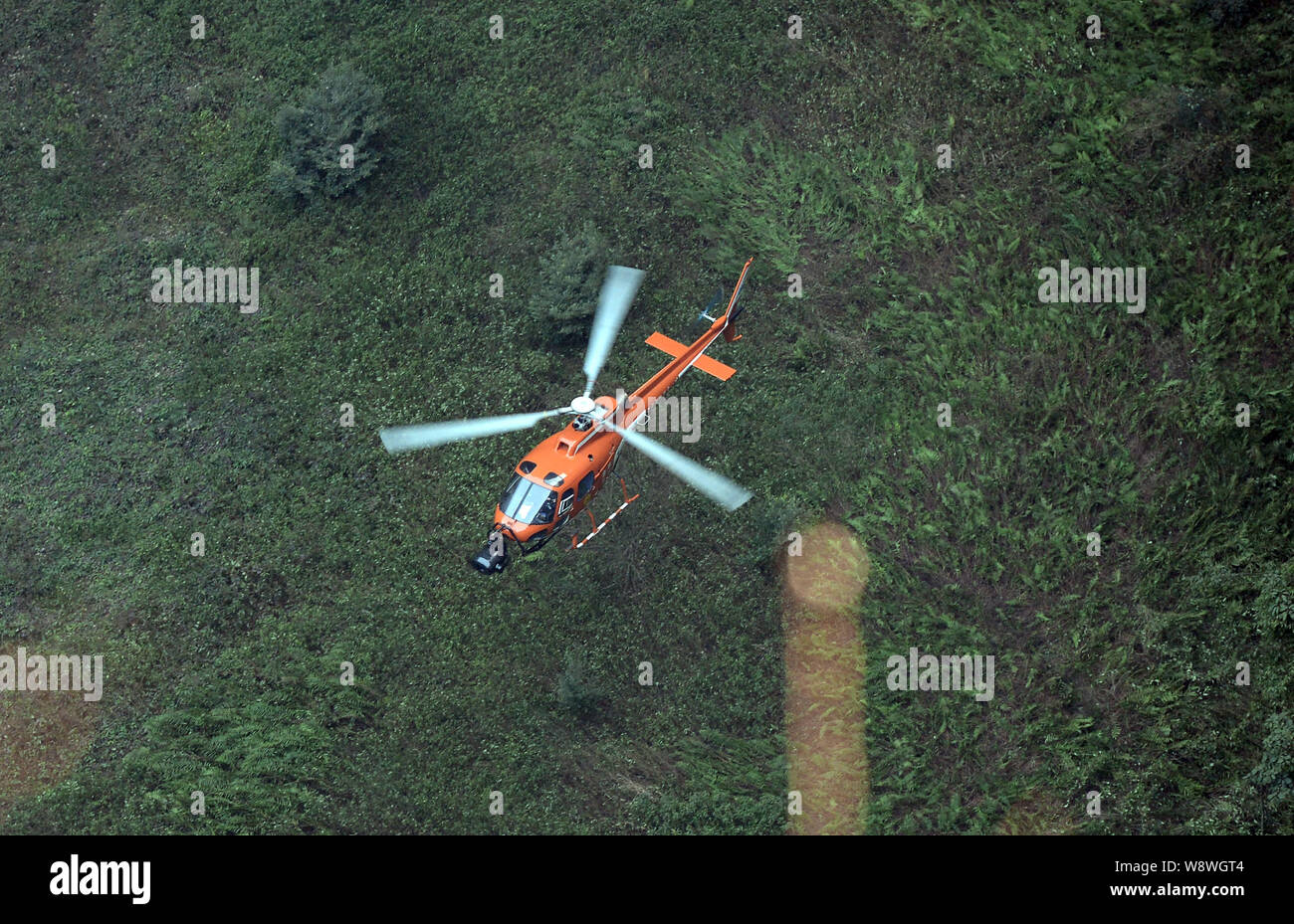 A helicopter flies to film scenes during a filming session for the ...
