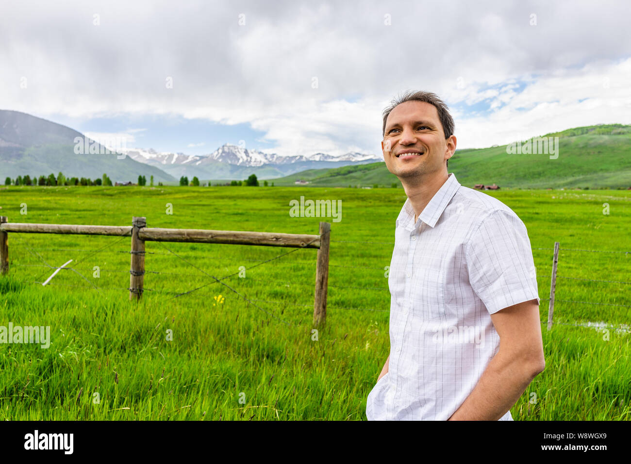 Crested Butte, Colorado countryside with happy man standing by rural ...