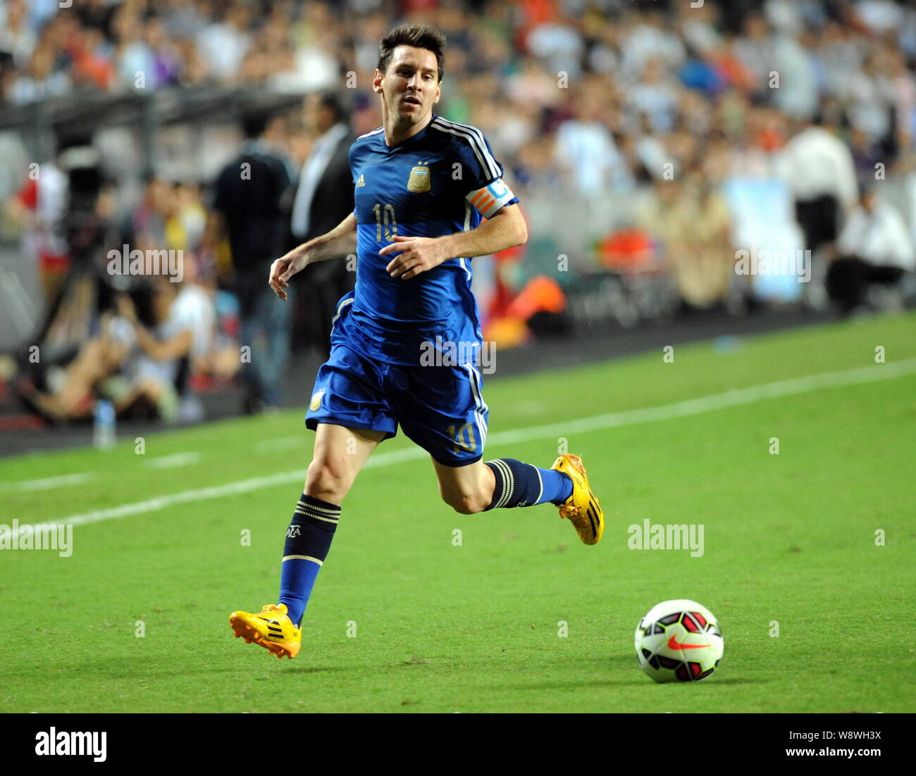 Lionel Messi of Argentina dribbles against Hong Kong during a friendly ...
