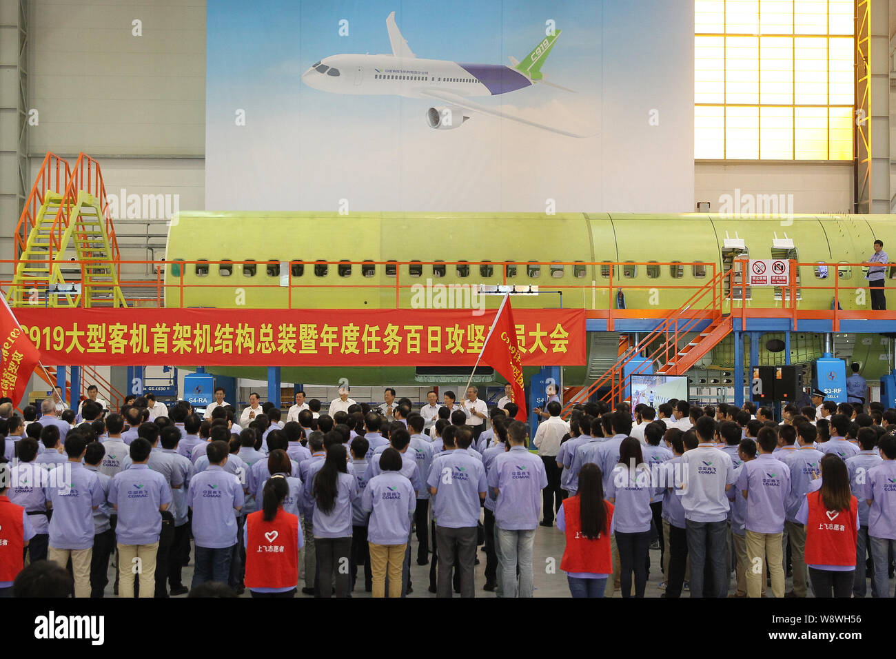 Chinese engineers and technicians look at the fuselage of China¯s first ...