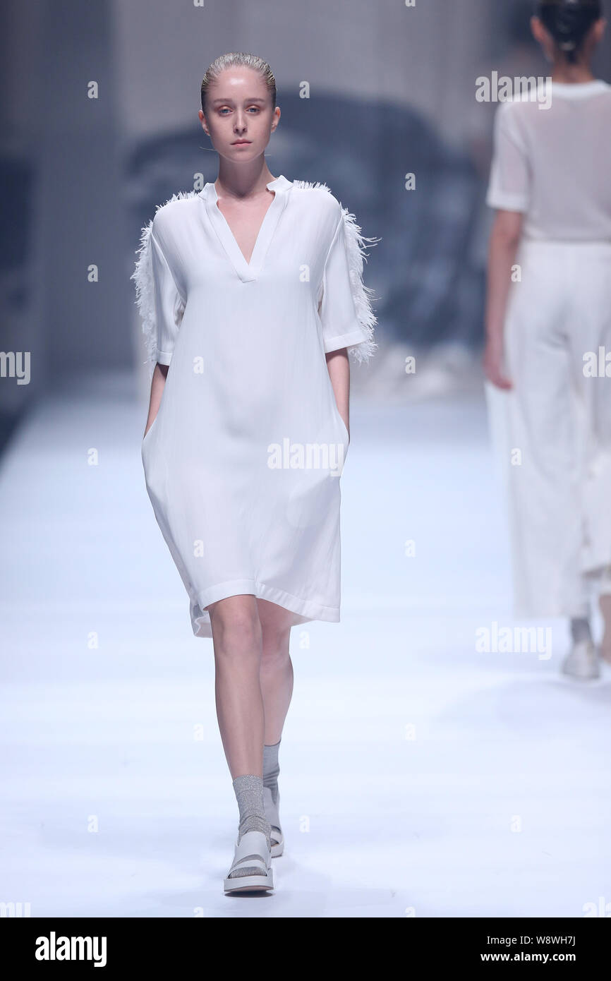 A model displays a new creation at the fashion show of Ji Cheng during ...