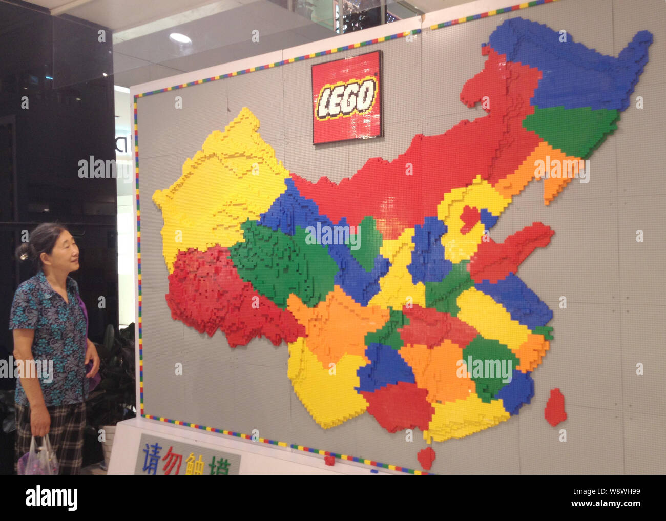 --FILE--A visitor looks at a map of China made by Lego bricks at the ...