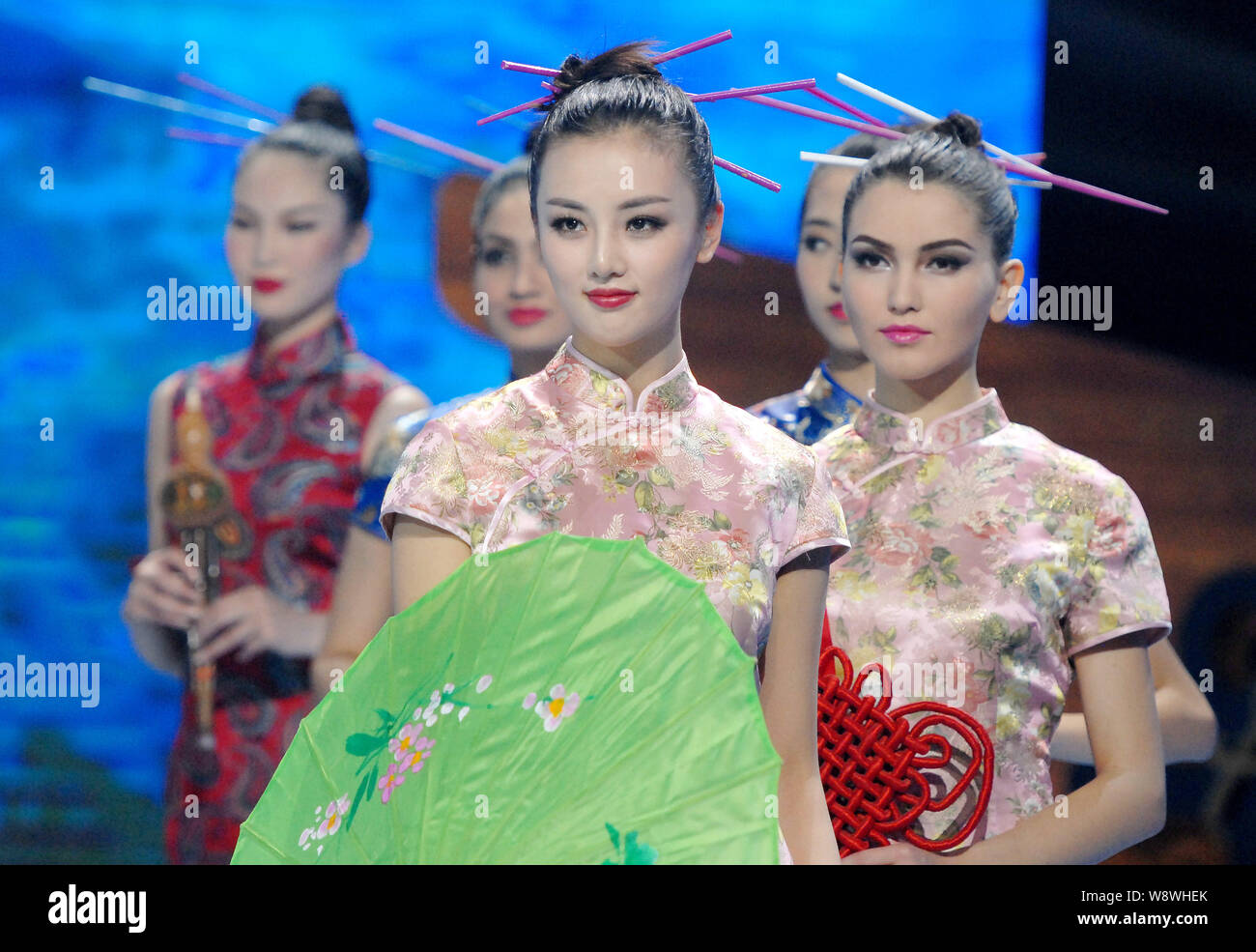 Chinese model Huo Jialin, front, and foreign models display creations ...
