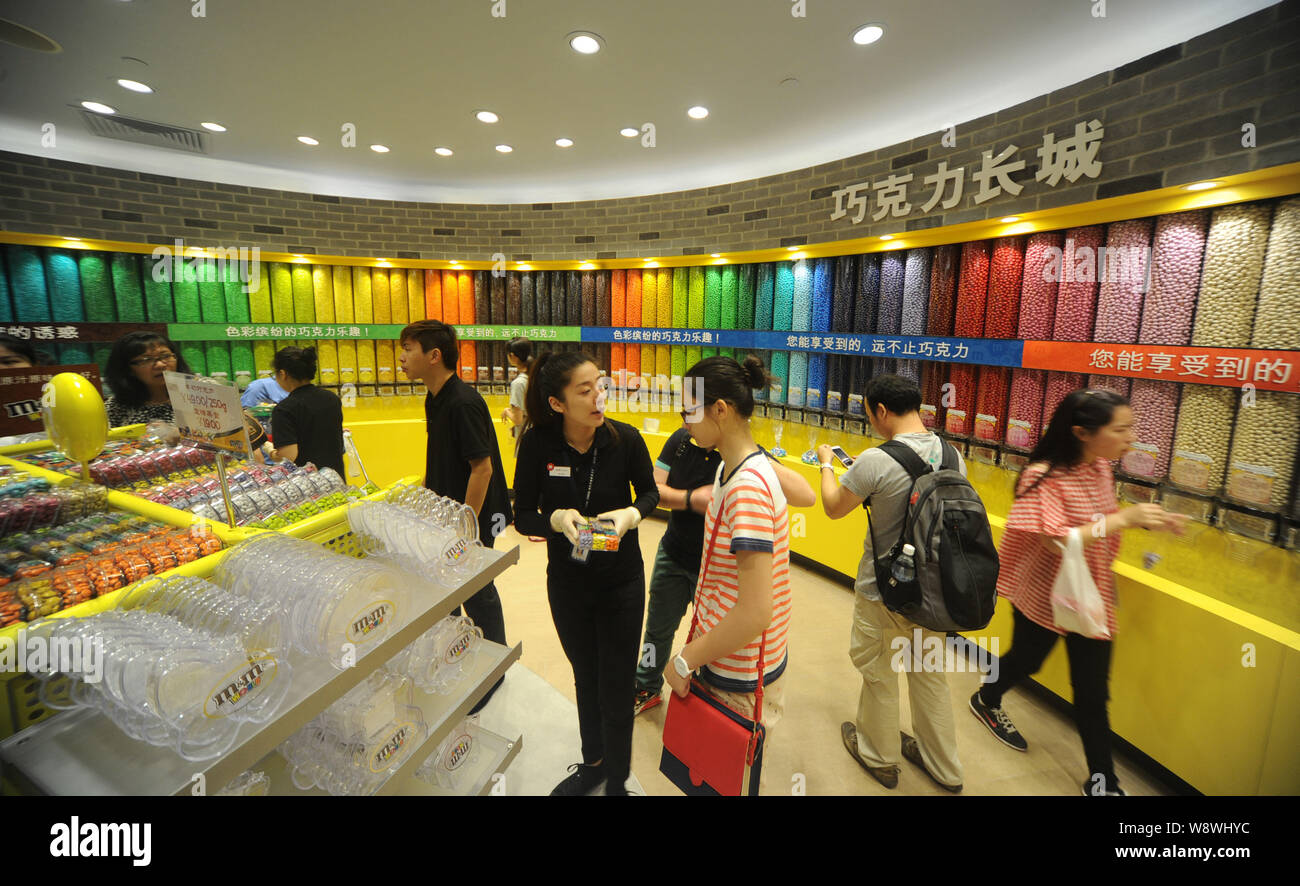 Customers buy chocolate candies at the flagship store of M&Ms in ...