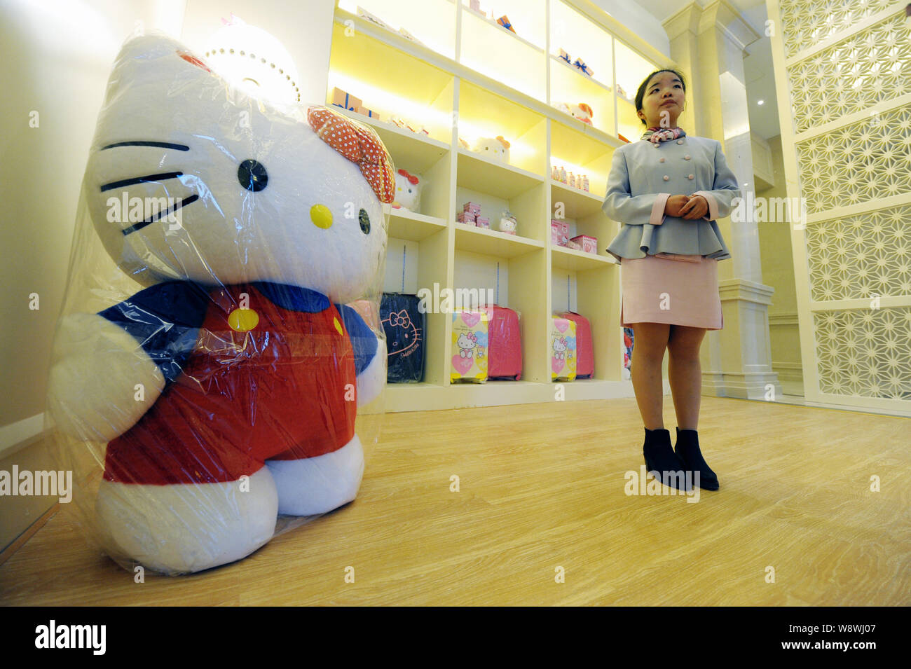 A Chinese employee is seen at a store in the Hello Kitty theme park in ...