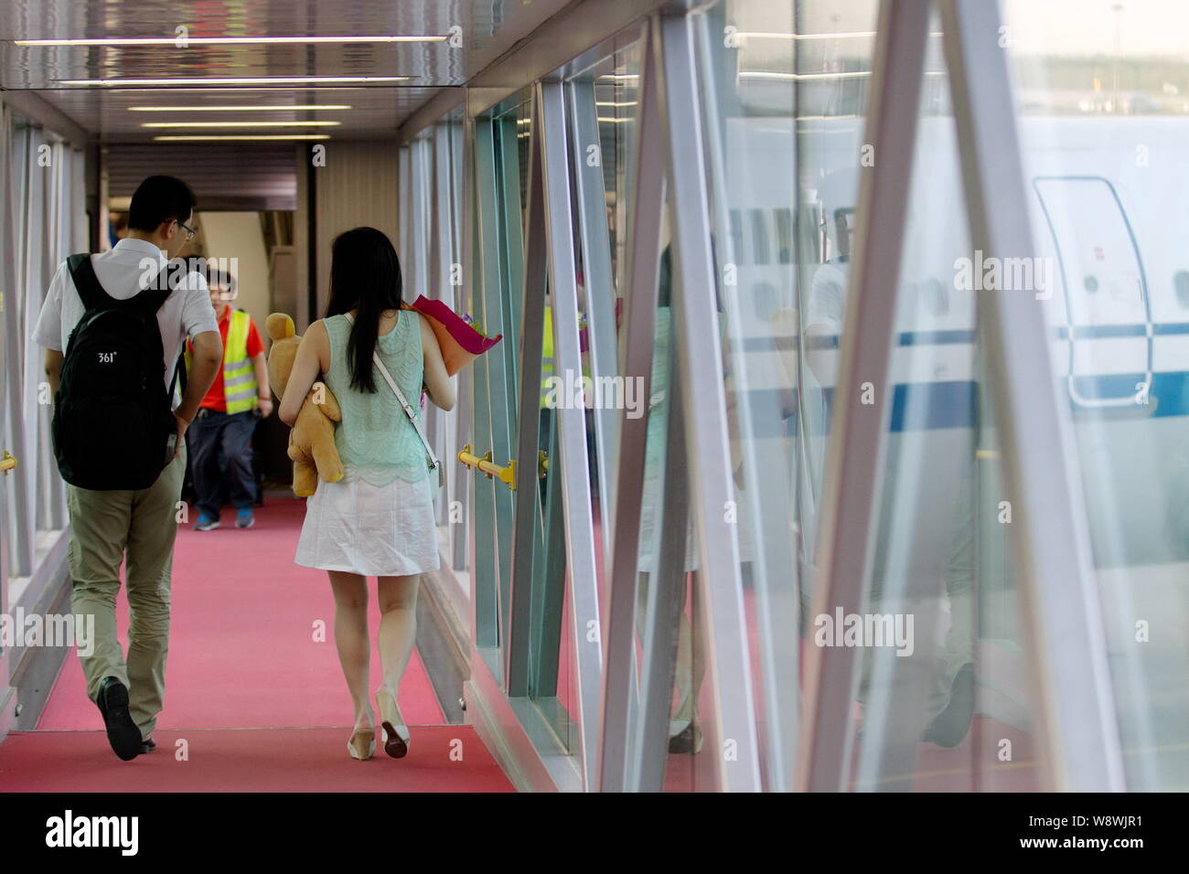 American table tennis player Ariel Hsing, right, walks to board Flight ...