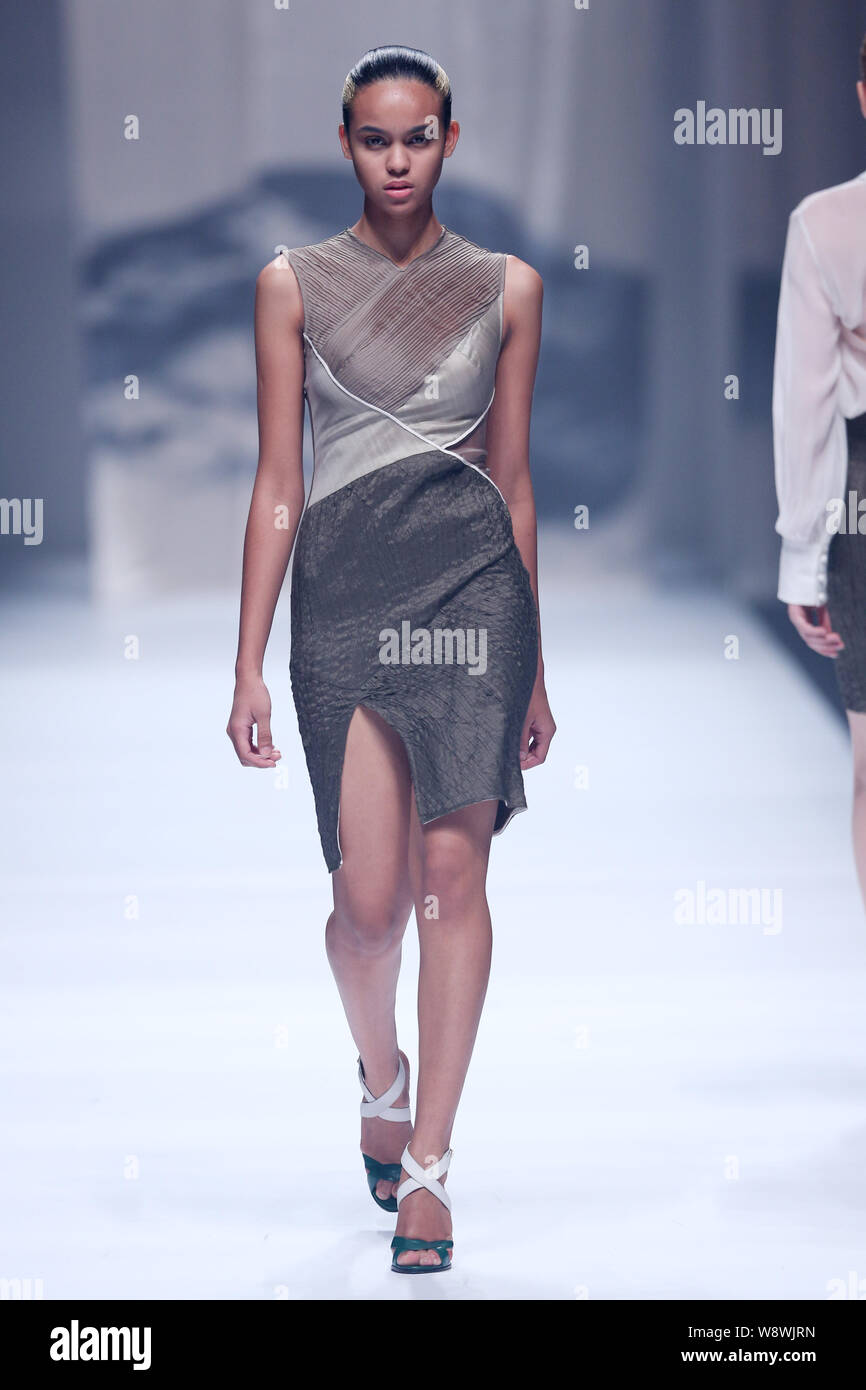 A model displays a new creation at the fashion show of Ji Cheng during ...