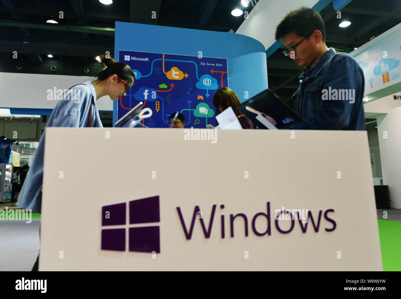 --FILE--Customers try out Surface Pro 3 tablet PCs installed with ...