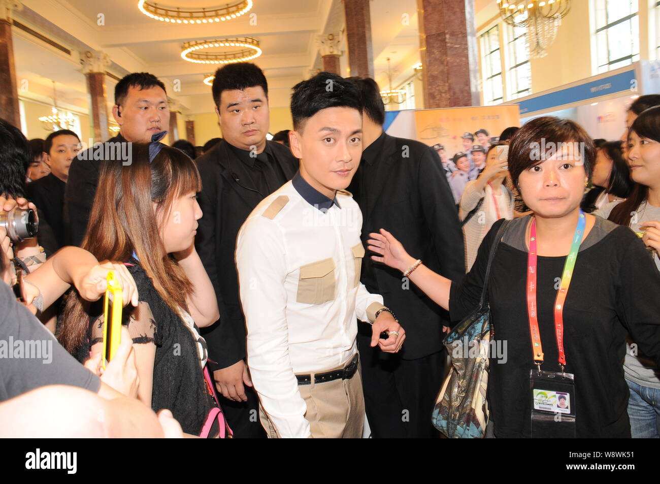 Hong Kong actors Bosco Wong, center, arrives for a press conference for ...