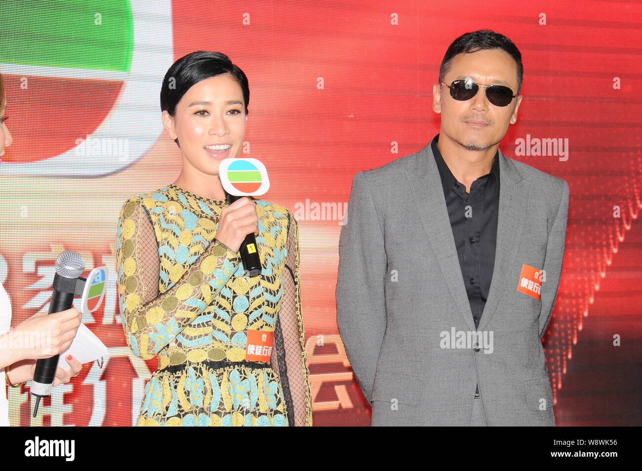 Hong Kong actress Charmaine Sheh, left, speaks next to actor Michael ...