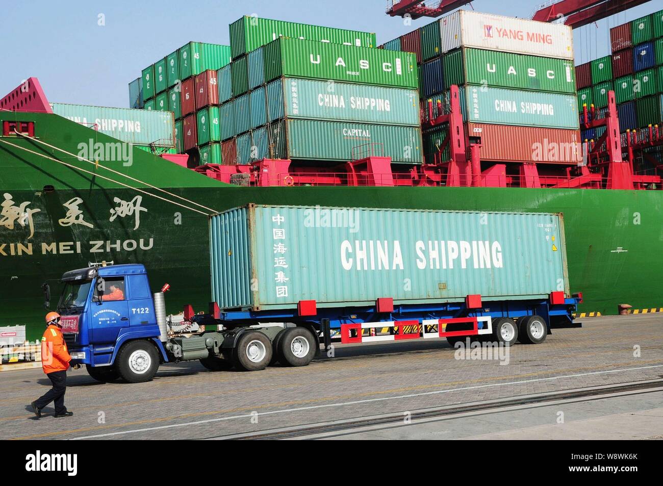 --FILE--A truck transports a container of China Shipping on a quay at ...