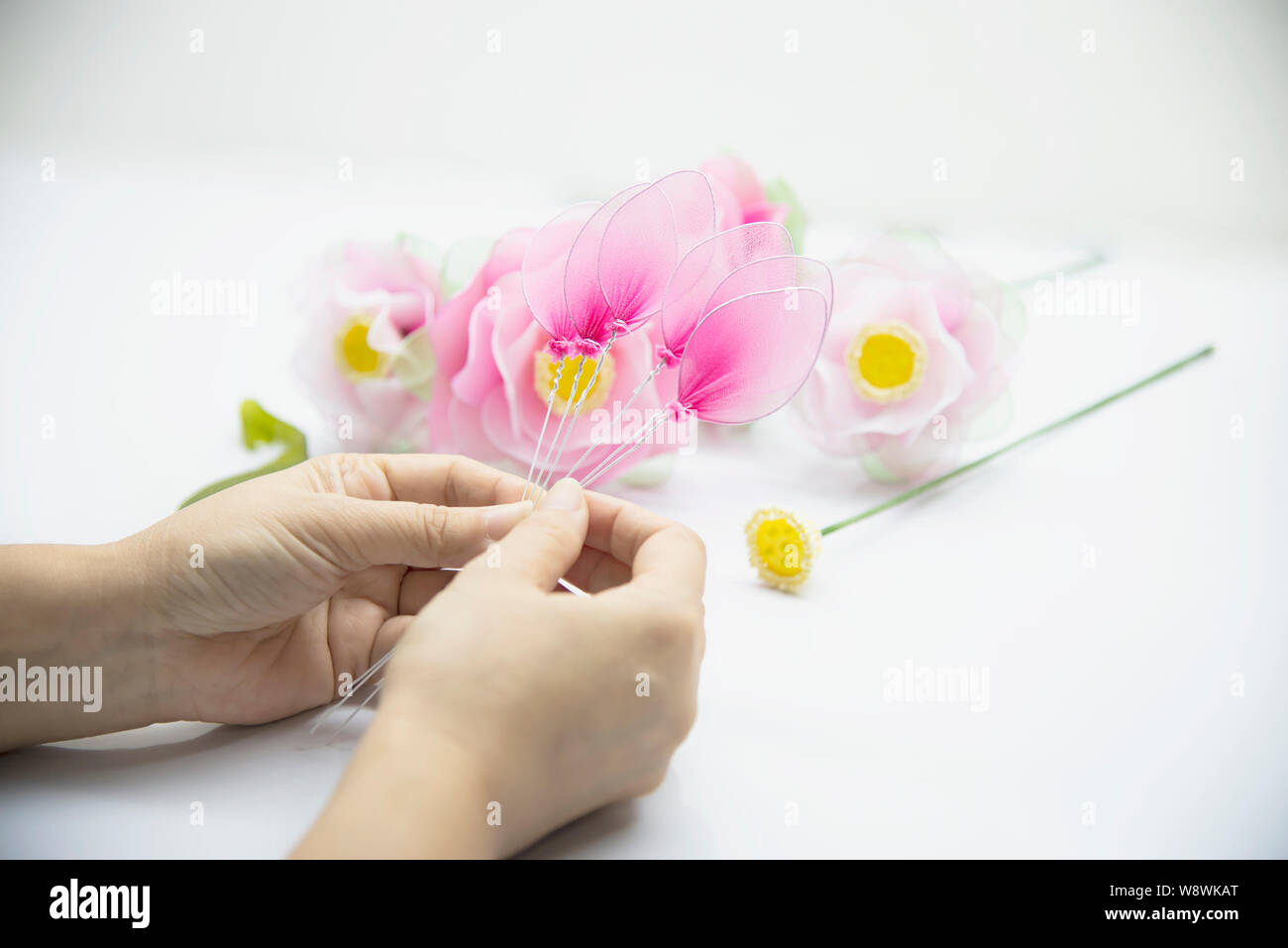 Woman making beautiful nylon flower - people with DIY handmade flower ...
