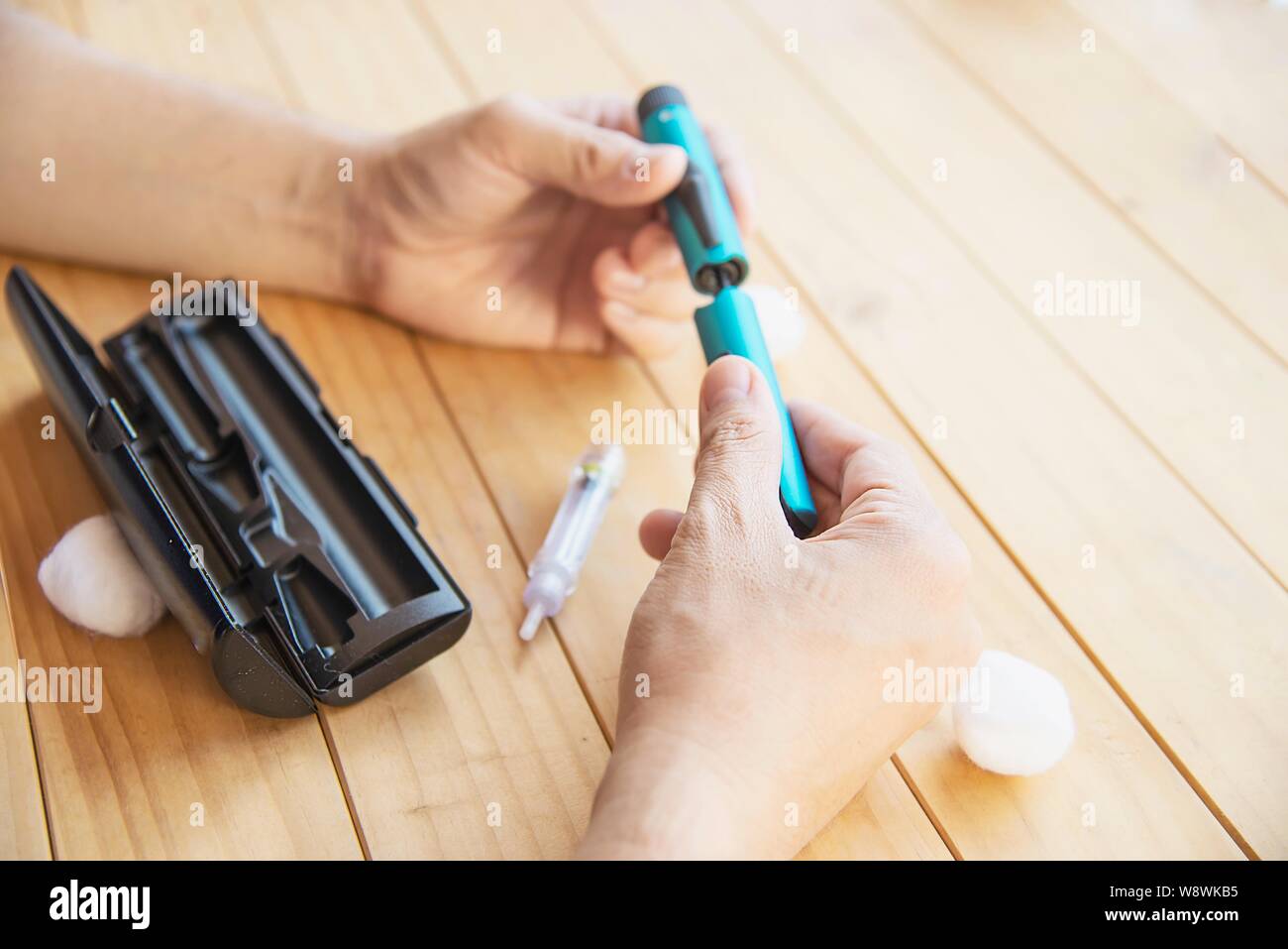 Man preparing insulin diabetic syringe for injection - people diabetic ...