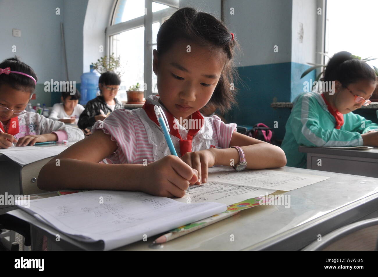 Chinese students are taking a mathematics exam in a classroom at a ...