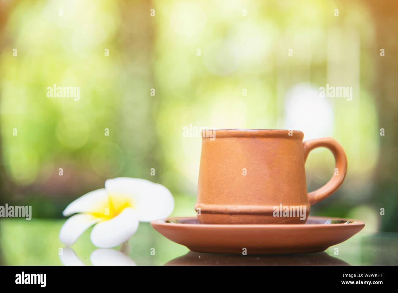 Coffee cup in green garden background - coffee with nature background ...