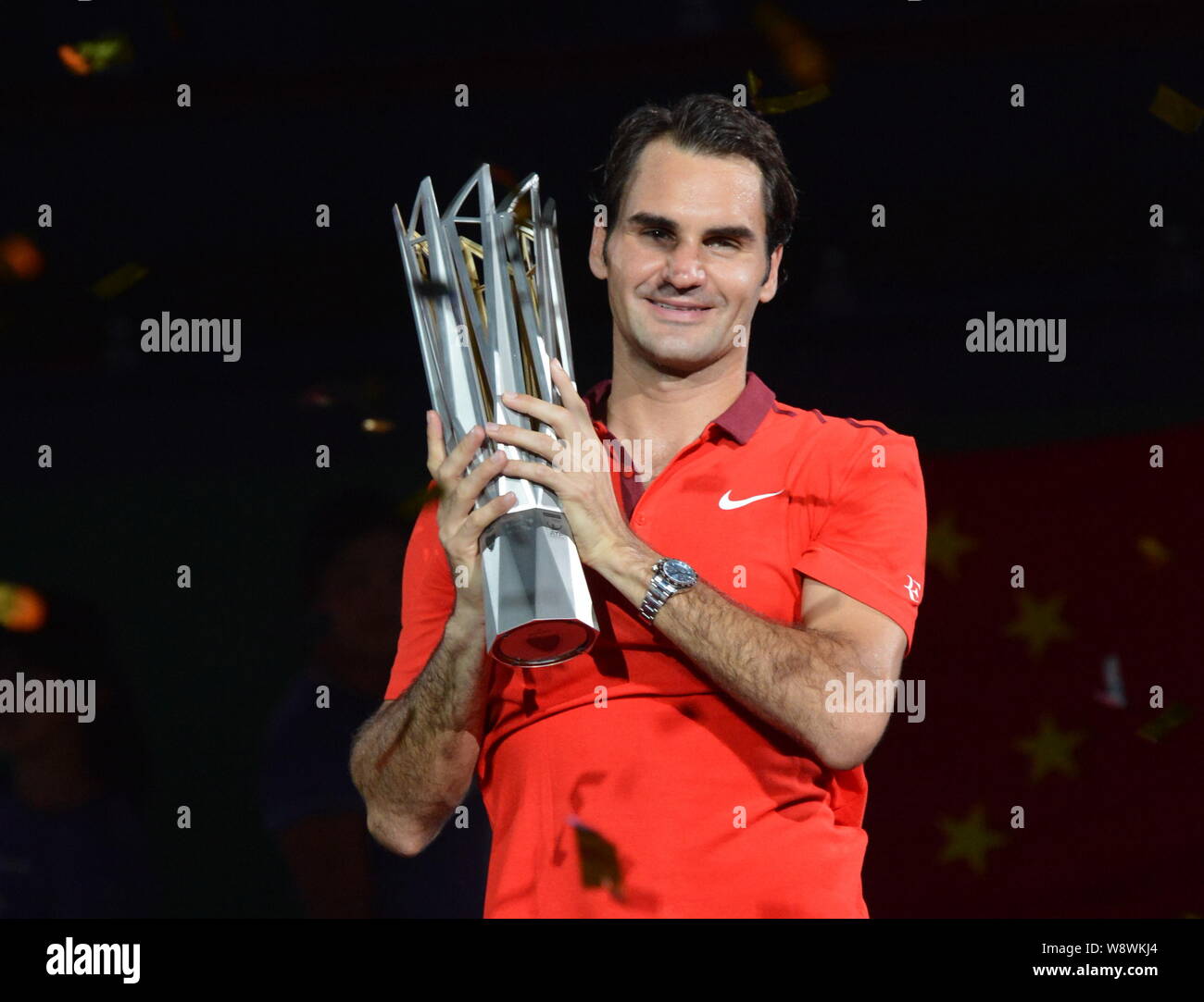 Roger Federer of Switzerland poses with his champion trophy at the ...