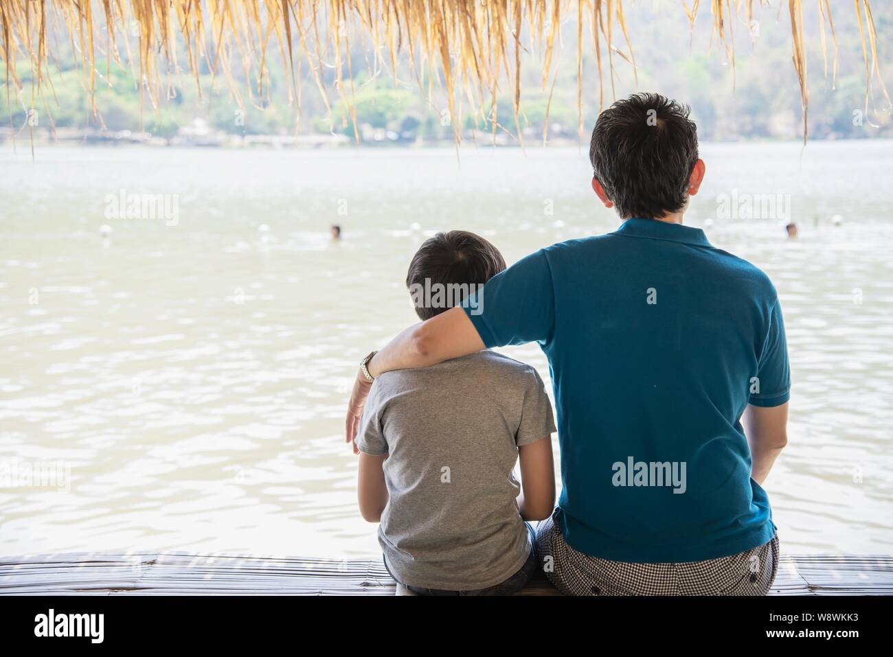 Happy dad and son during vacation at water site nature - happy family ...