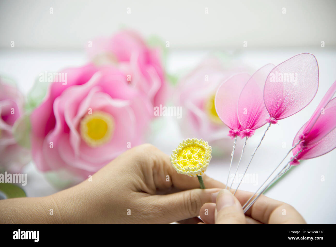 Woman making beautiful nylon flower - people with DIY handmade flower ...