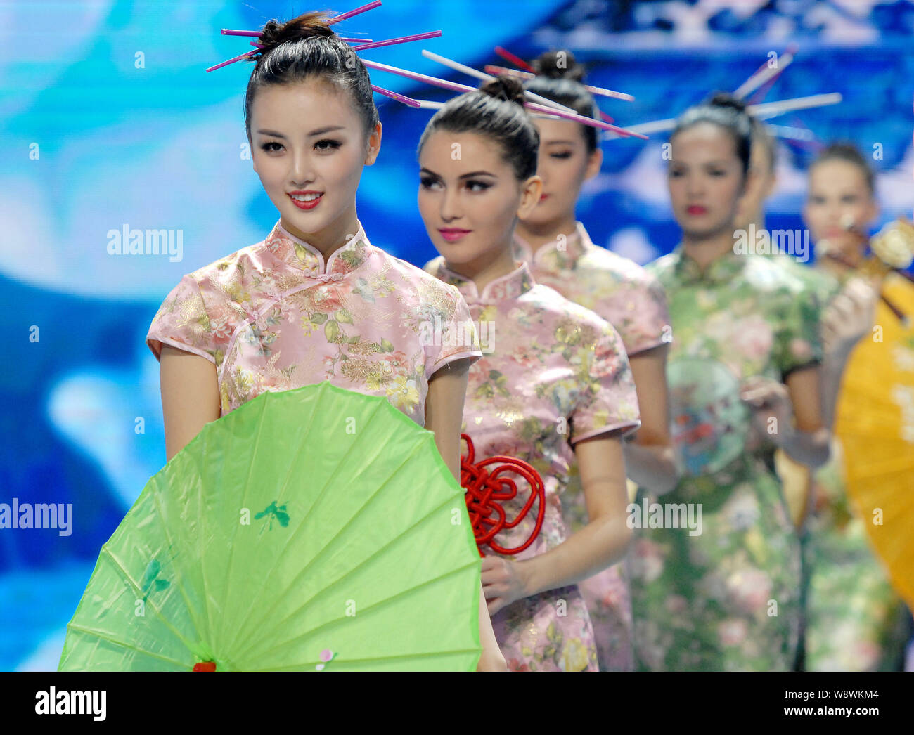 Chinese model Huo Jialin, front, and foreign models display creations ...