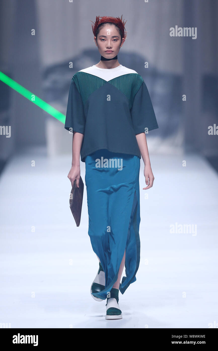 A model displays a new creation at the fashion show of Ji Cheng during ...