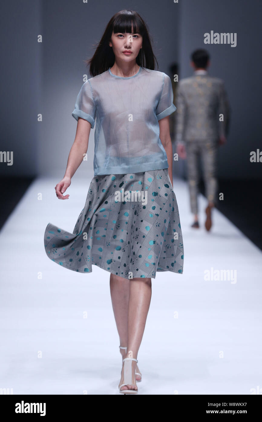 A model displays a new creation at the VDS in shanghai fashion show ...