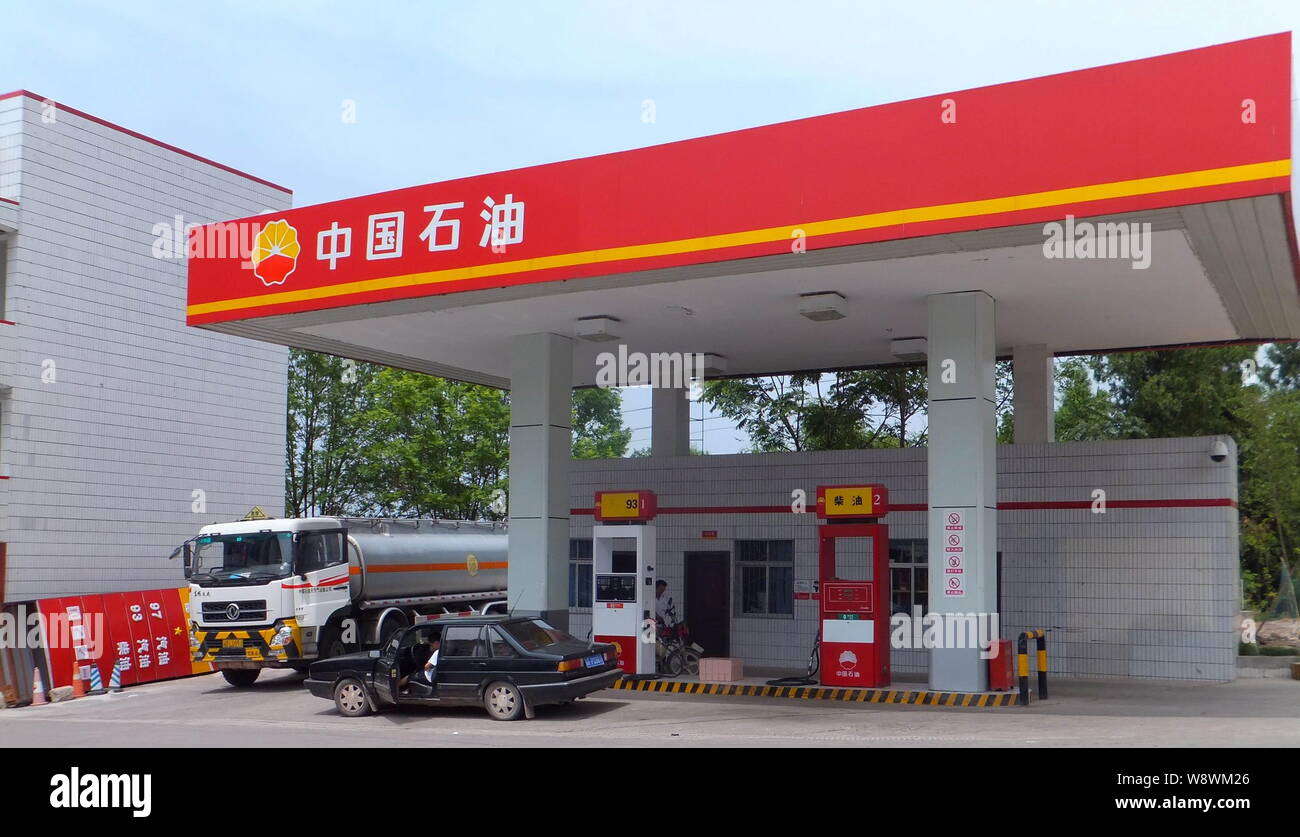 --FILE--Vehicles are being refueled at a gas station of PetroChina, a ...