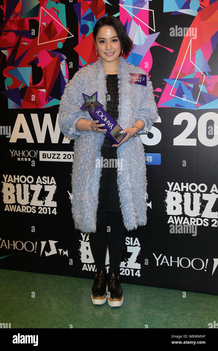 Singer and actress Gillian Chung of Hong Kong pop duo Twins poses with her trophy after the ...