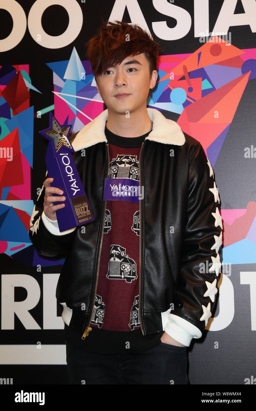 Hong Kong singer and actor Ken Hung Cheuk-lap poses with his trophy after the presentation ...