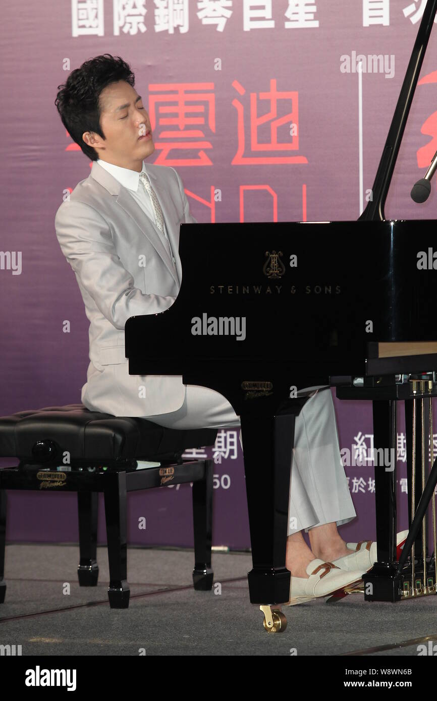 Chinese pianist Li Yundi performs during a press conference for his ...