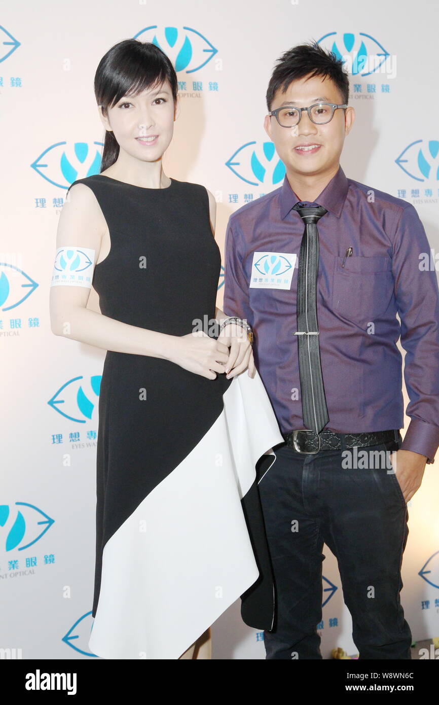 Hong Kong singer and actress Vivian Chow, left, poses with an executive ...