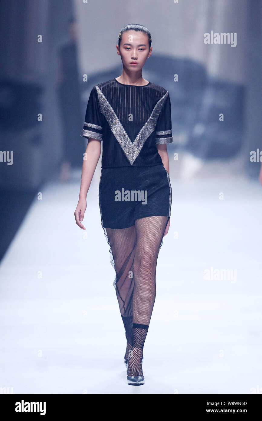 A model displays a new creation at the fashion show of Ji Cheng during ...