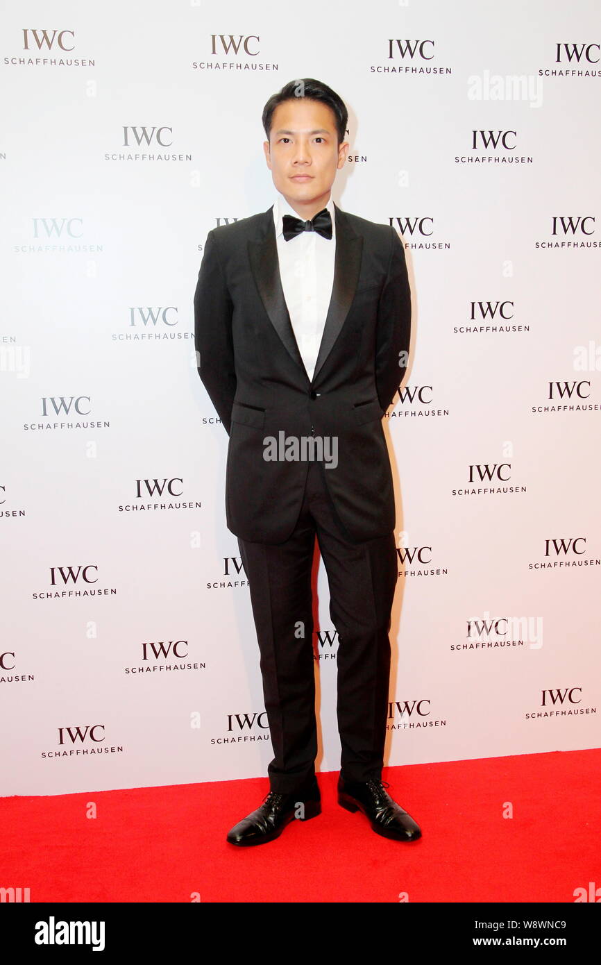 Former Hong Kong singer Real Ting poses on the red carpet as he arrives ...