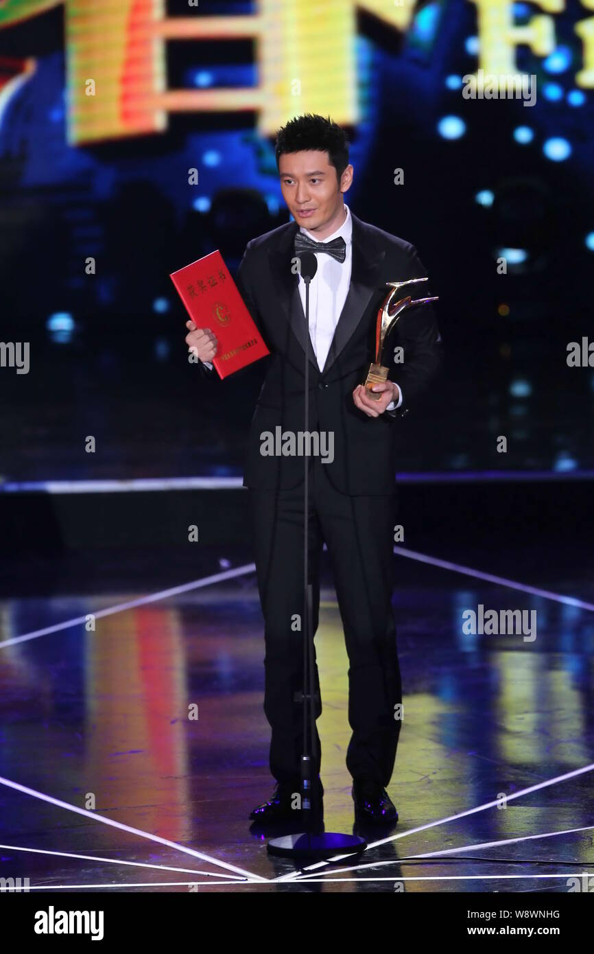 Chinese actor Huang Xiaoming speaks with his "Best Actor" trophy during ...
