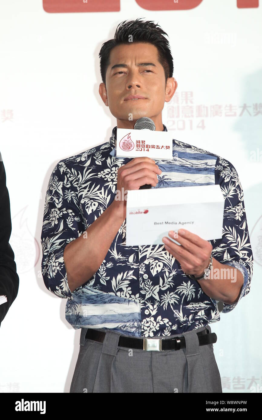 Hong Kong singer and actor Aaron Kwok Fu-shing announces the winner of the Best Media Agency ...