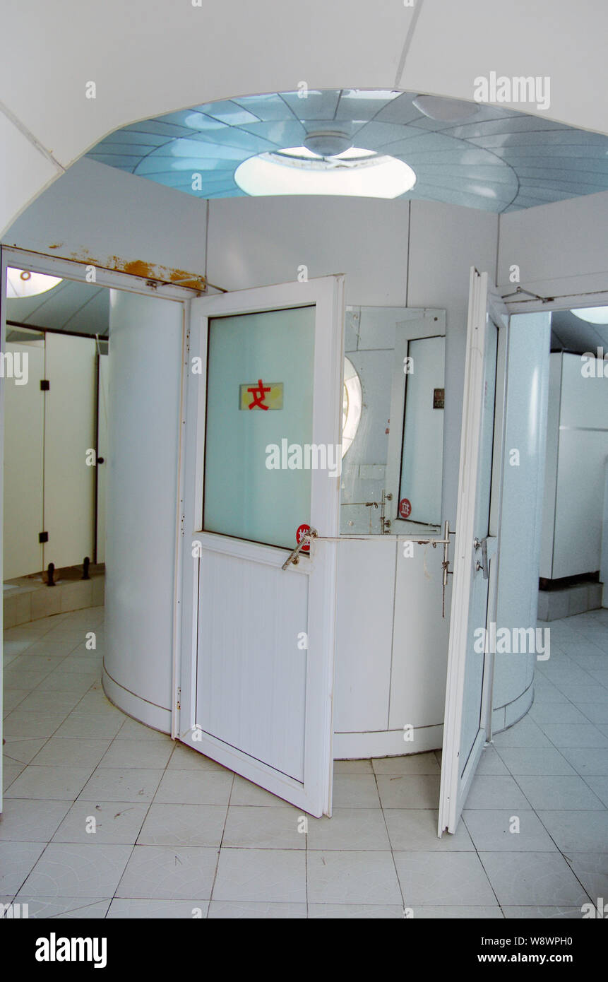 Interior view of a UFO-shaped toilet at a scenic spot near a beach in ...