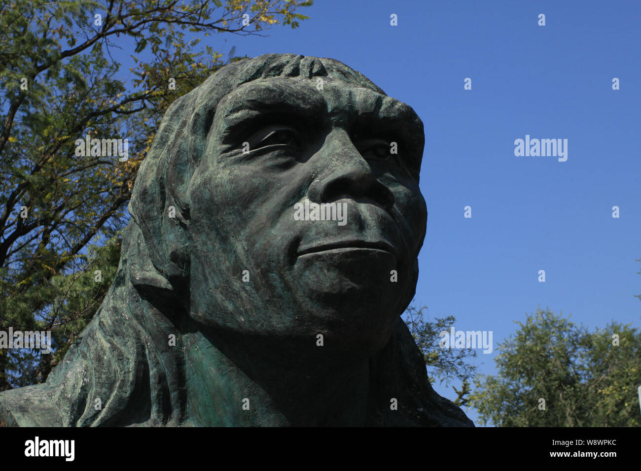 View of a sculpture of a Peking Man at the Peking Man Site at ...