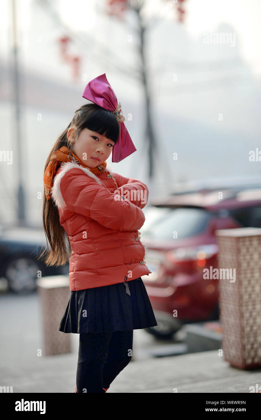 6-year-old Chinese child model Zhou Ziling poses on a street before a ...