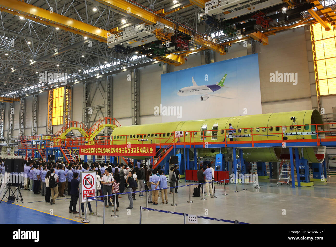 Chinese engineers and technicians look at the fuselage of China¯s first ...