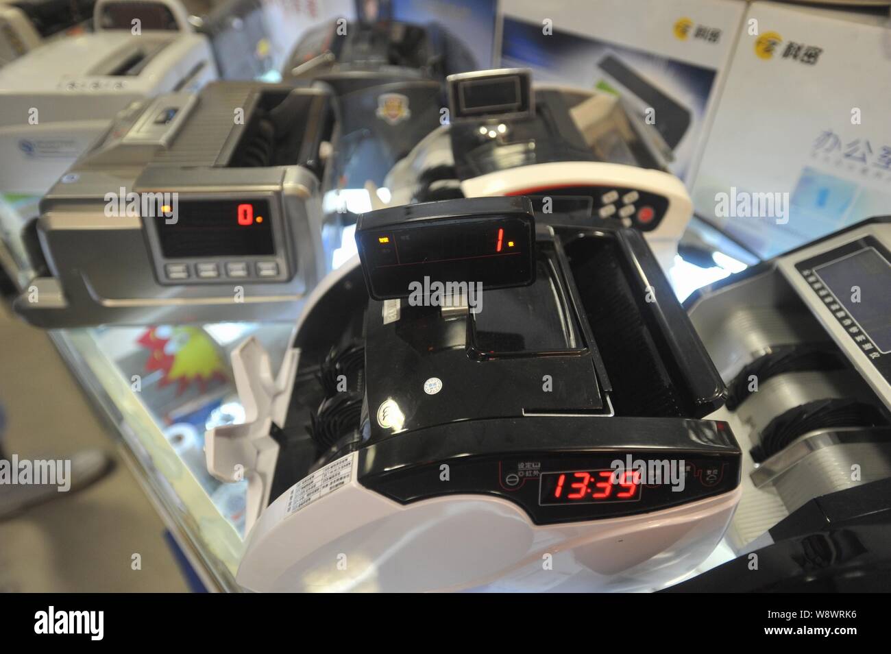 Cash-counting machines are for sale at a market in Shenyang city ...
