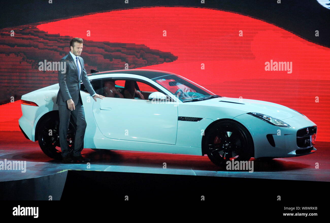 English football superstar David Beckham poses with a Jaguar F-Type ...