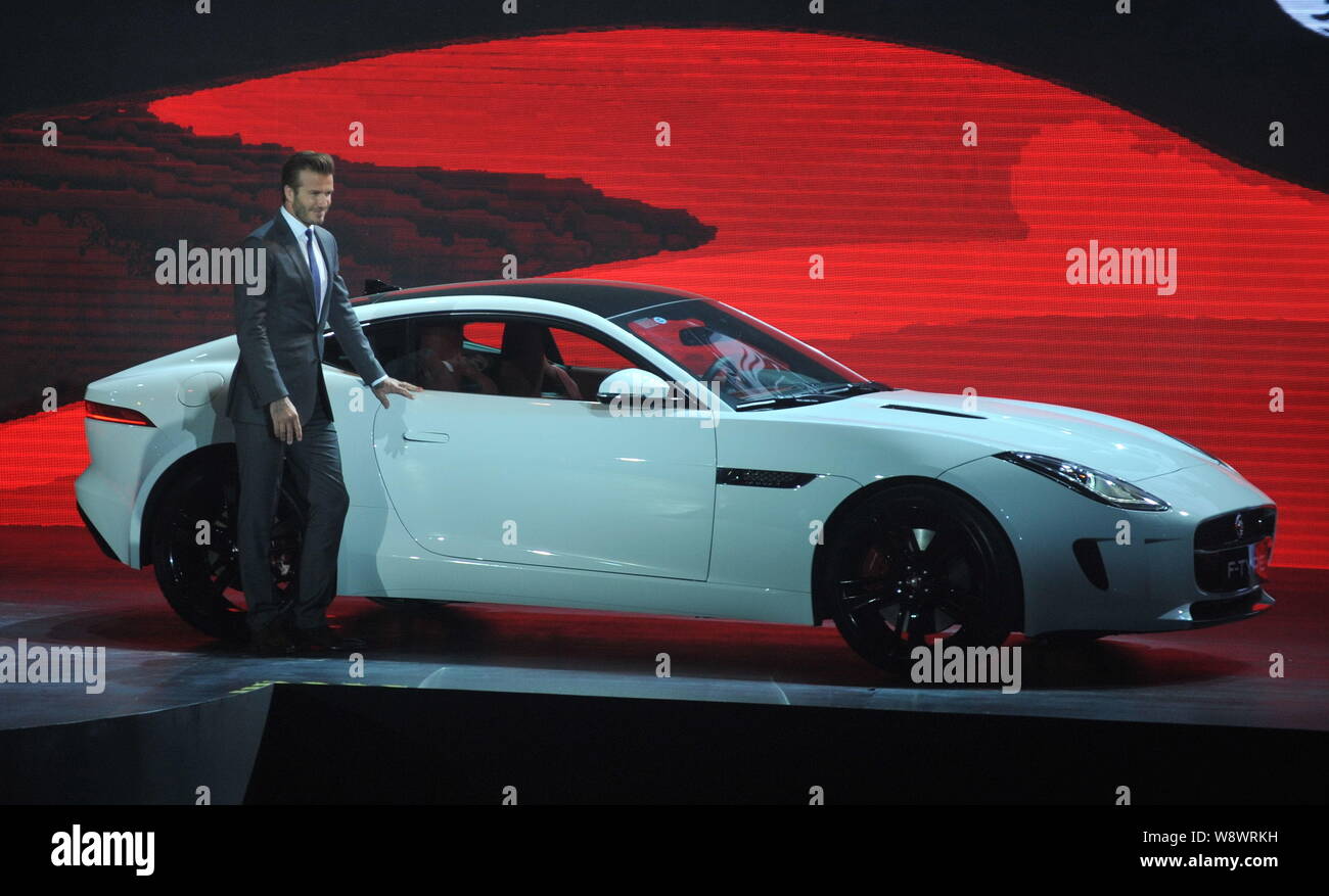 English football superstar David Beckham poses with a Jaguar F-Type ...