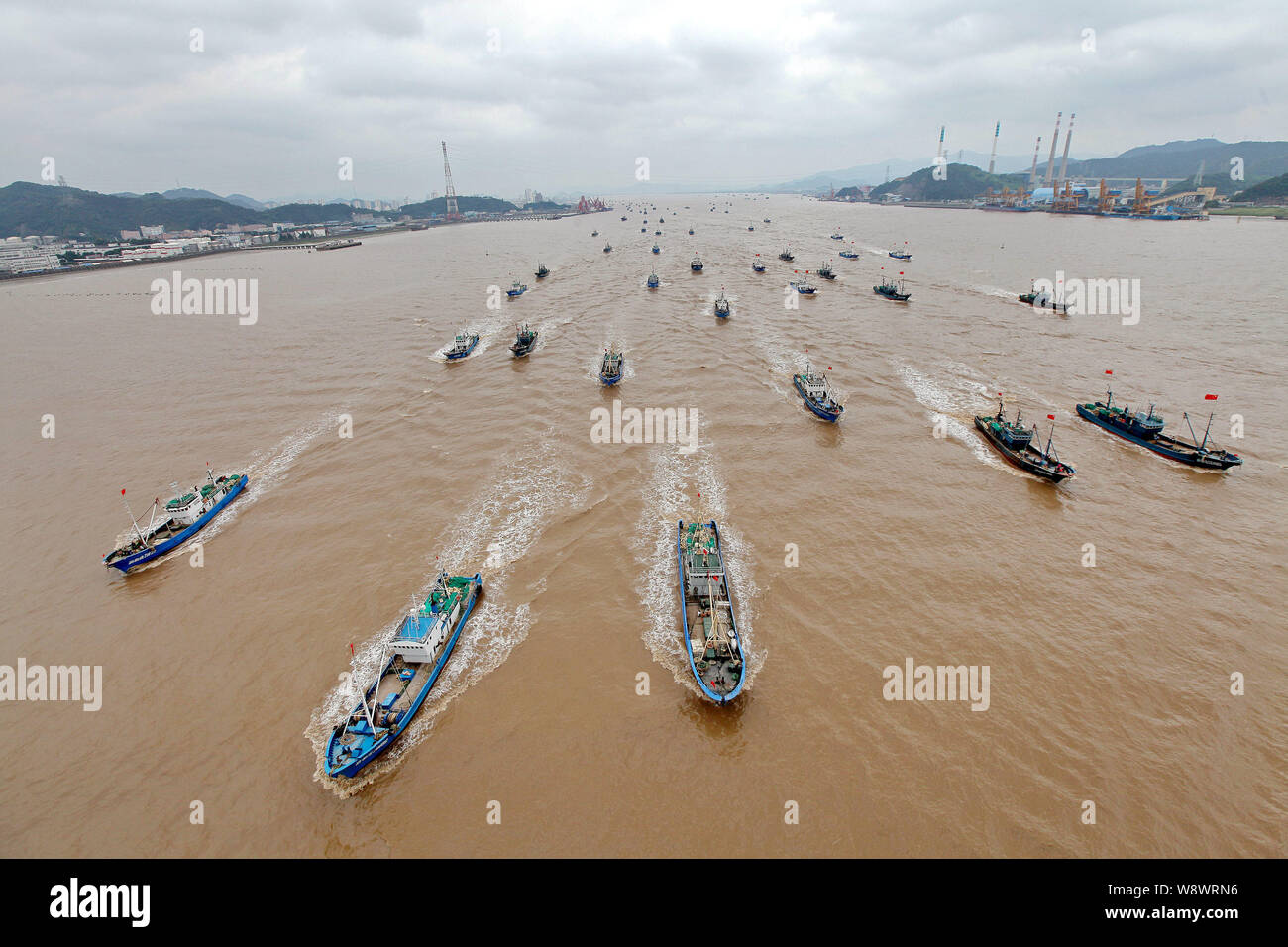 Chinese fishing boats set out from Haimen Harbor for the East China Sea ...
