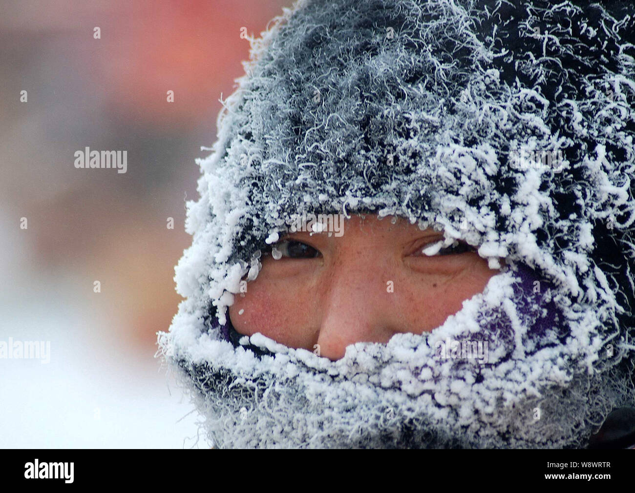 A pedestrian wearing a hat against a cold front is pictured in Yakeshi ...