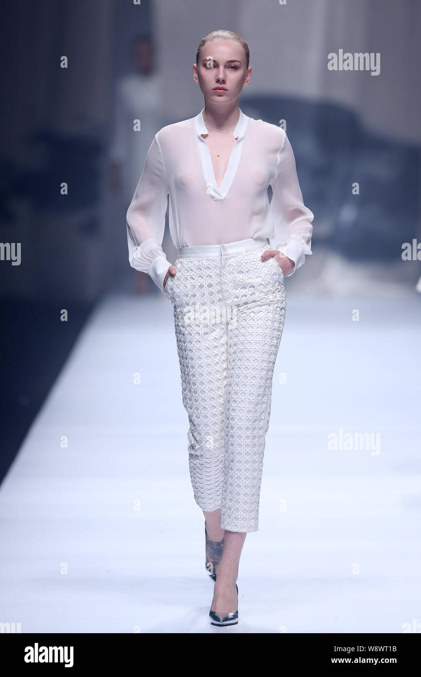 A model displays a new creation at the fashion show of Ji Cheng during ...