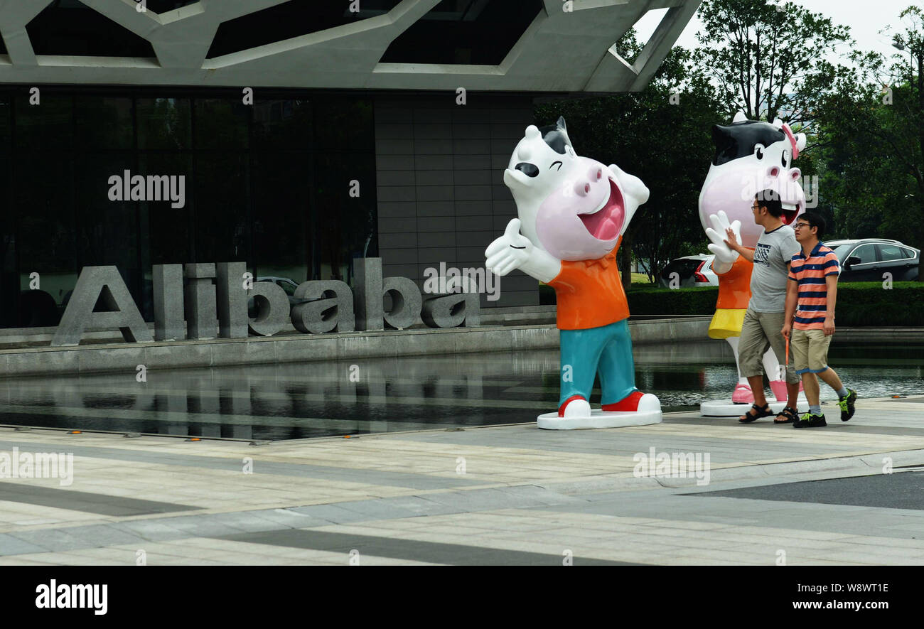 --FILE--Chinese employees walk at the headquarters of Alibaba Group in ...